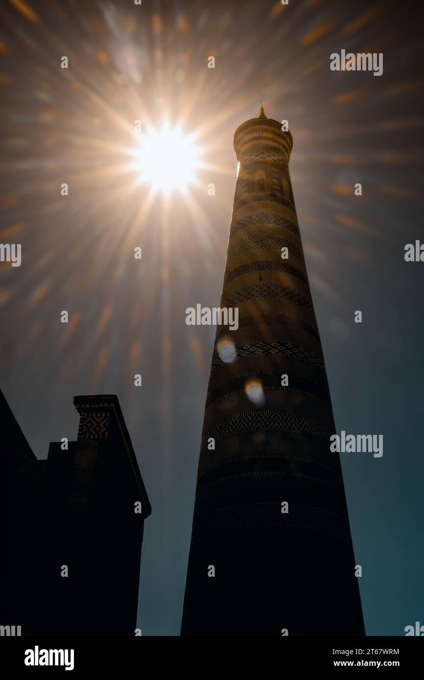Minaret of the mosque in the back light, Uzbekistan, central asia Stock ...