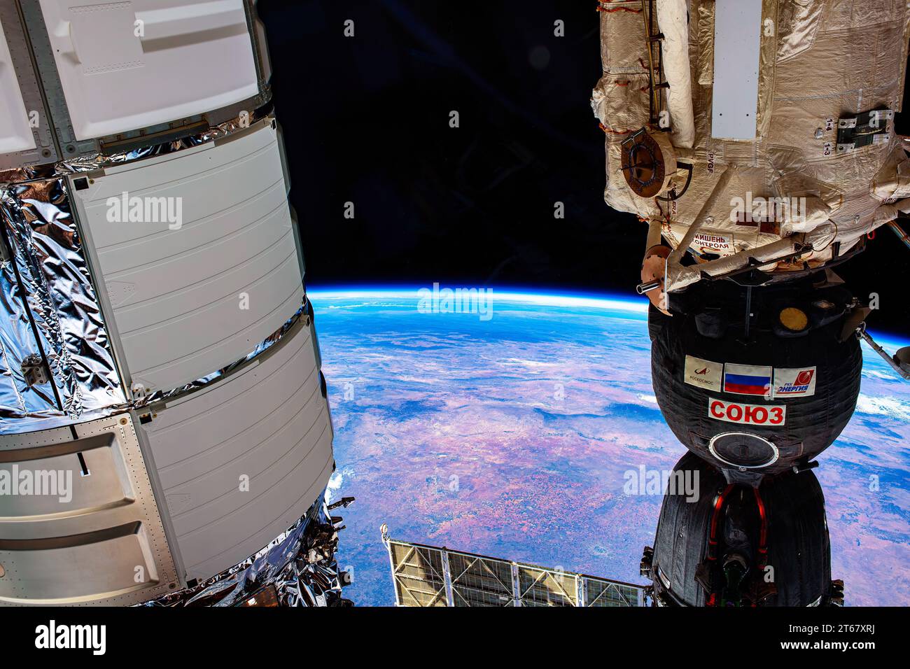 Soyuz Spacecraft and ISS. Digital enhancement of an image by NASA Stock ...