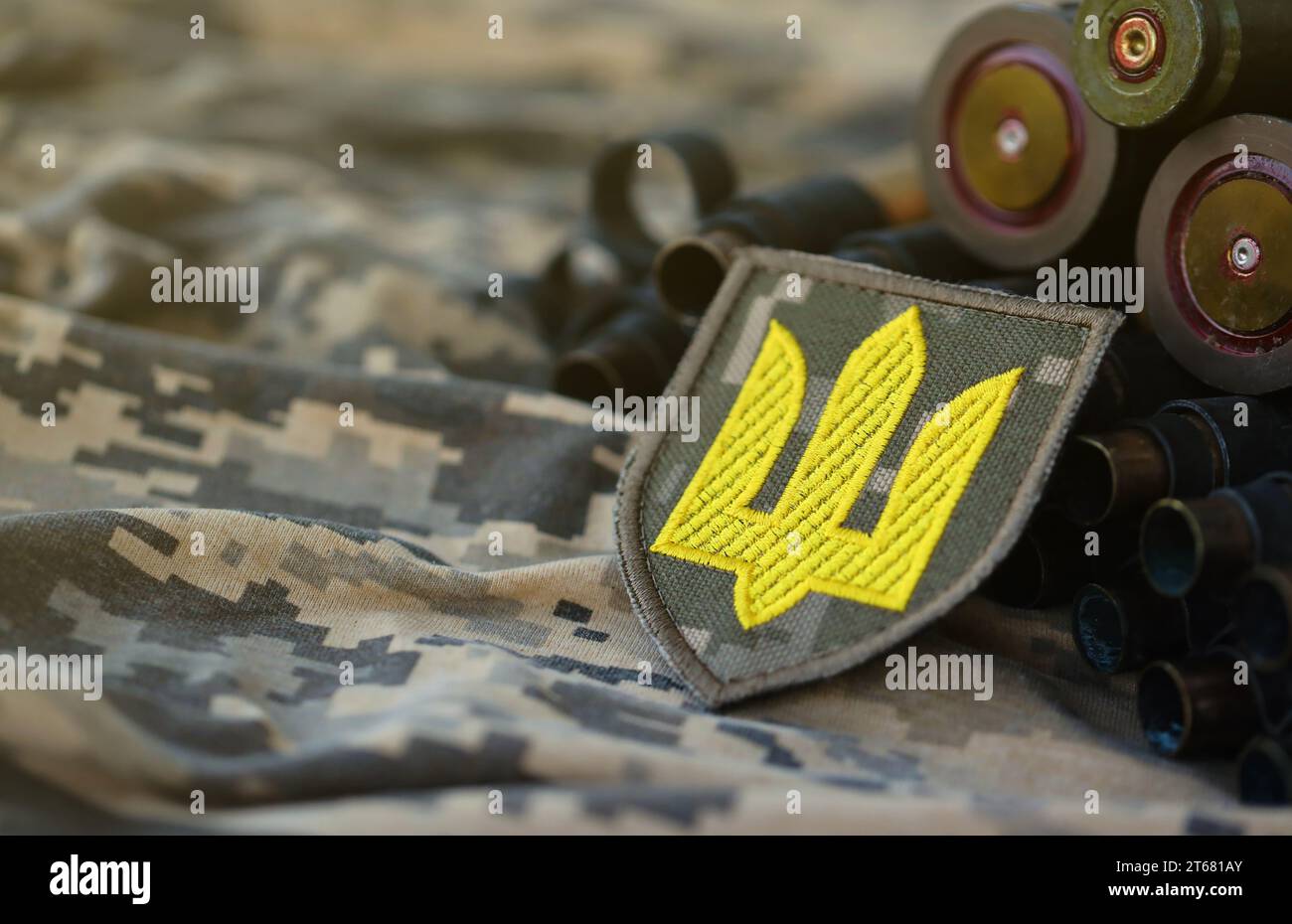 Ukrainian army symbol on machine gun belt lies on ukrainian pixeled ...