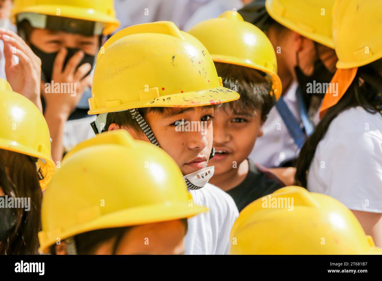 Quezon City, Philippines. 9th Nov, 2023. Students wearing hard hats ...