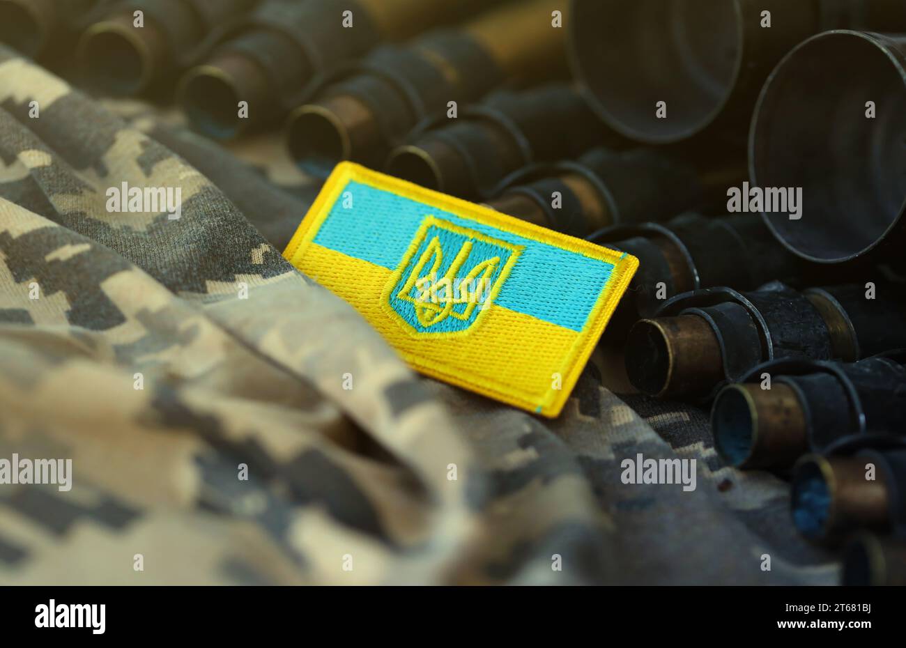 Ukrainian symbol on machine gun belt lies on ukrainian pixeled military ...
