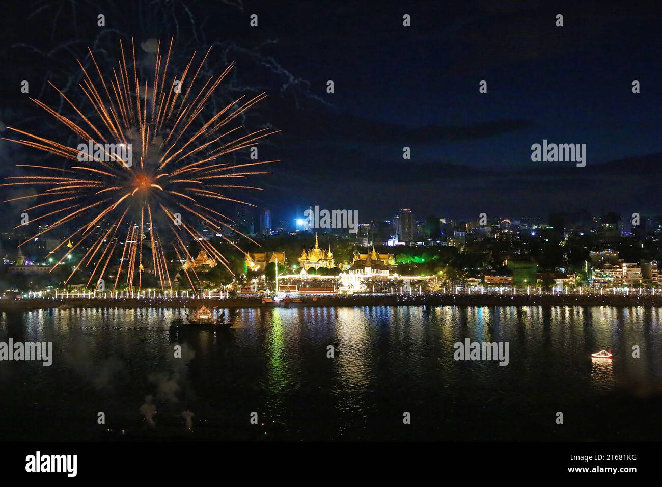Aerial view of fireworks exploding over Tonle Sap River, illuminated ...