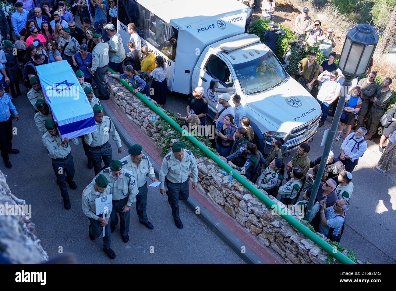 Border police officers carry the flagged draped coffin of border Police ...