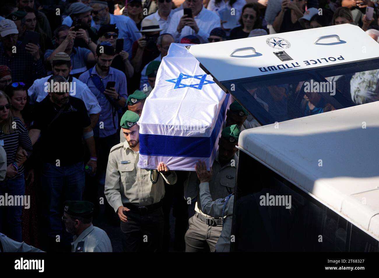 Border police officers carry the flagged draped coffin of border Police ...