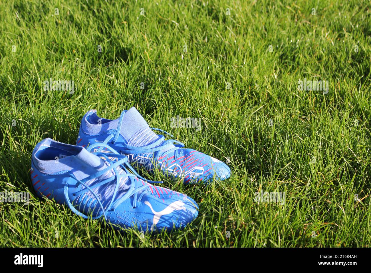 Football Boots on Pitch Stock Photo - Alamy