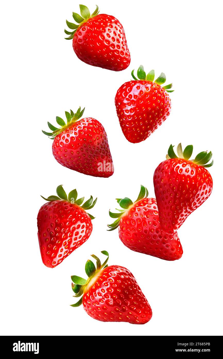 Whole falling strawberry fruits on white Stock Photo - Alamy