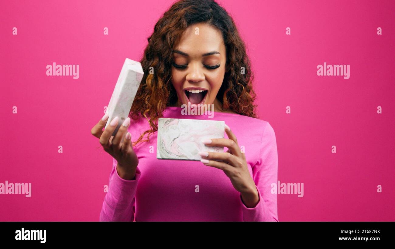 Excited young woman opens hi-res stock photography and images - Alamy
