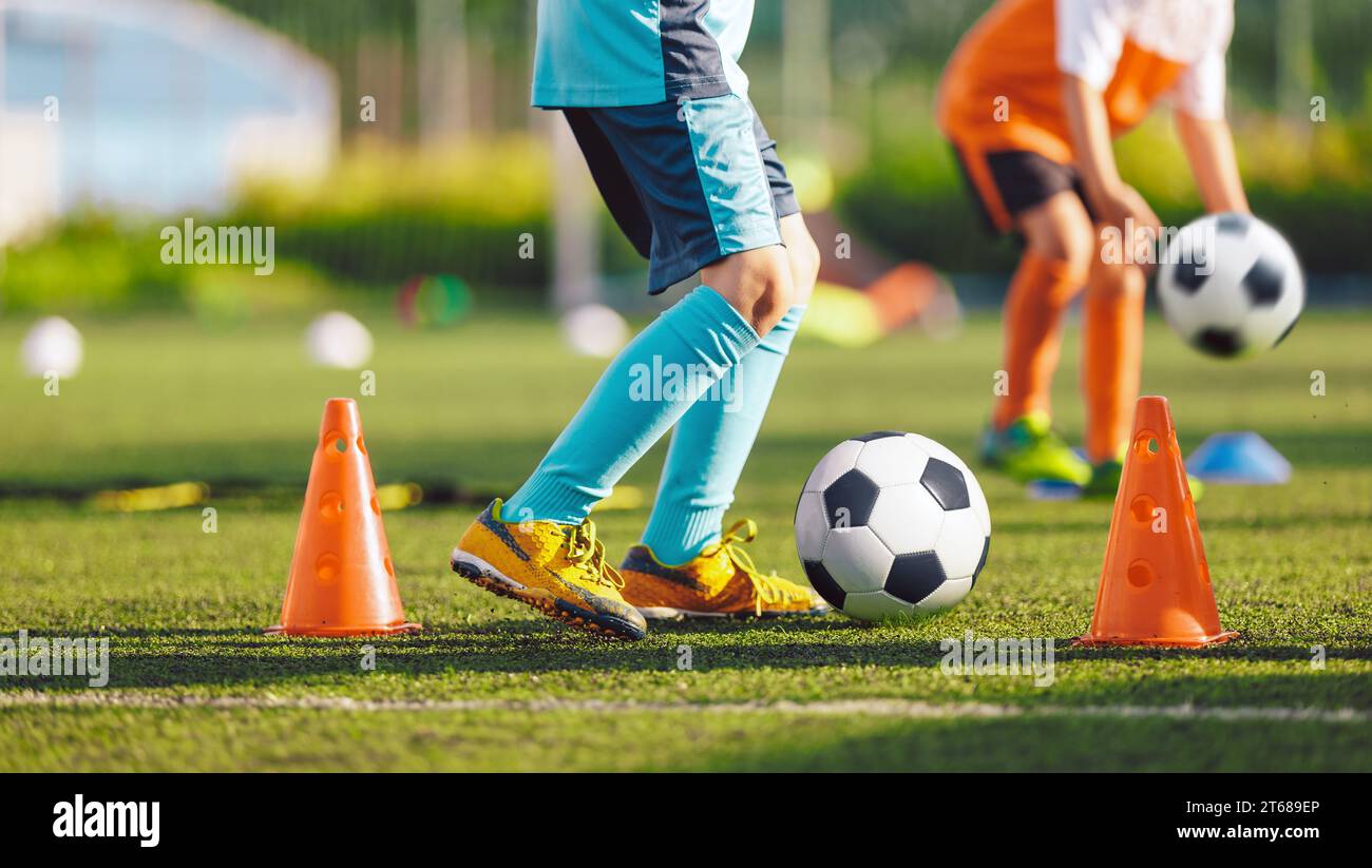 Children in Blue and Orange Soccer Team in Training. Two Kids Playing ...