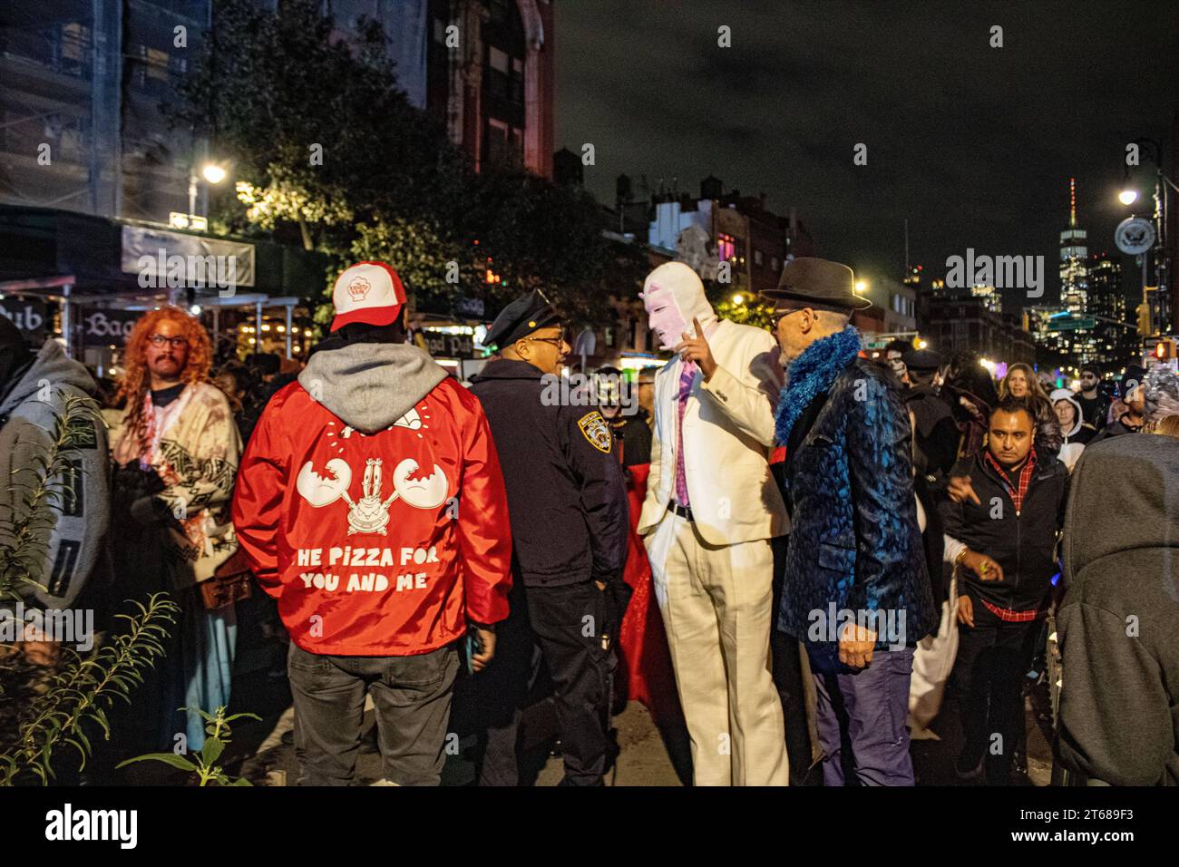 A bustling city street with a diverse crowd of people walking in the ...