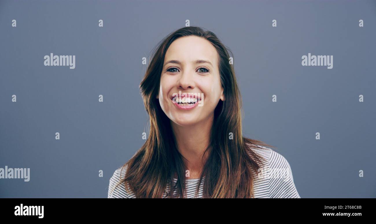 Face, happy or woman laughing at joke or crazy comedy in studio ...