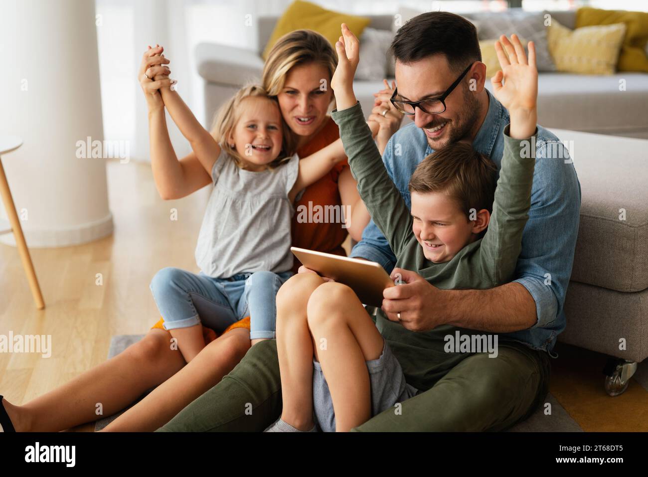 Device technology family online education concept. Happy family with ...