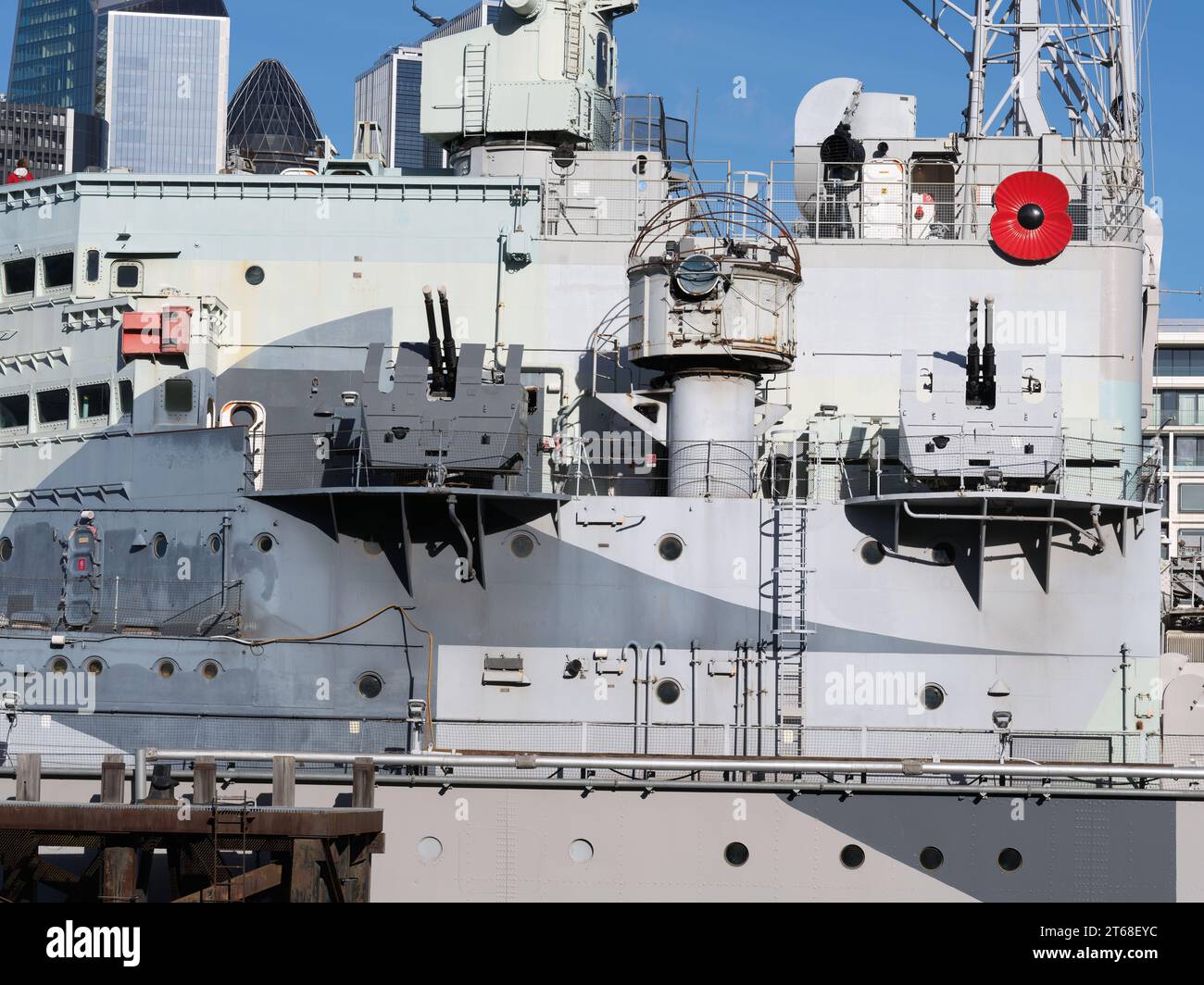 A giant red poppy displayed on HMS Belfast, built for the Royal Navy ...