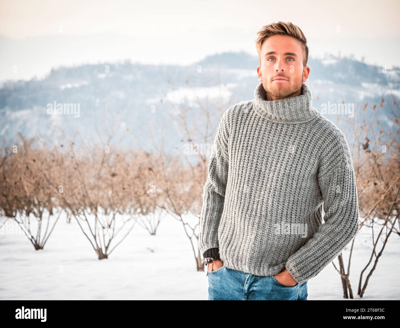Male model posing in snow hi-res stock photography and images - Alamy