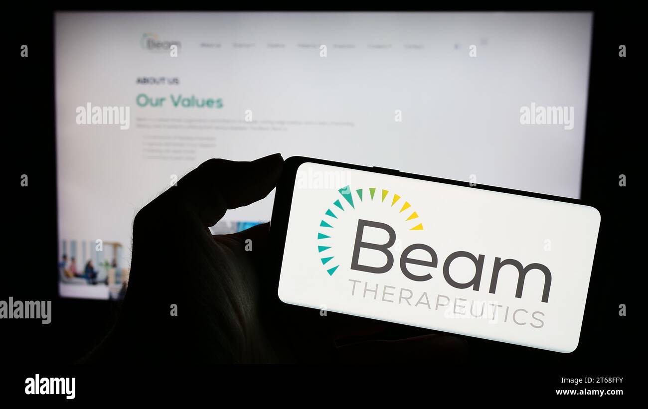 Person holding mobile phone with logo of American biotechnology company ...