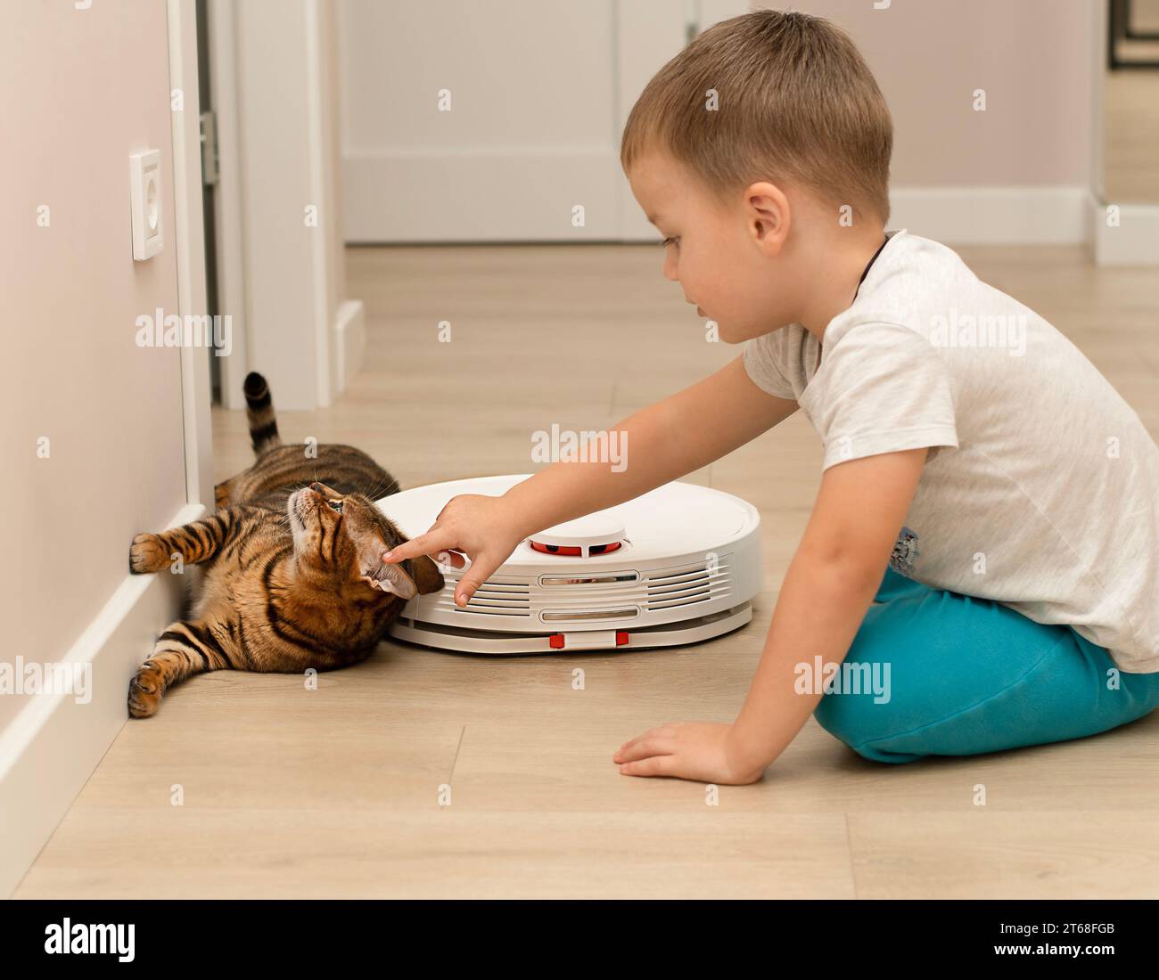 A little boy, 4 years old, and a beautiful, red, domestic, leopard cat ...
