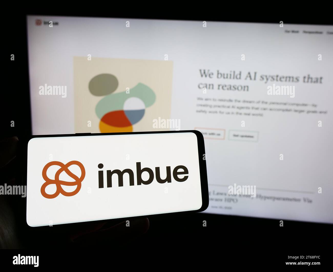 Person holding mobile phone with logo of US artificial intelligence (AI ...