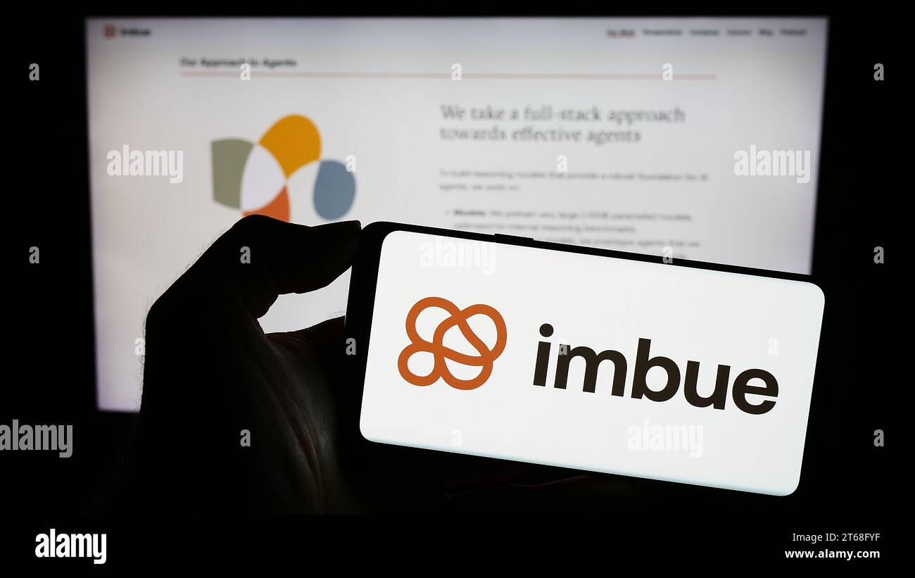 Person holding cellphone with logo of American artificial intelligence ...