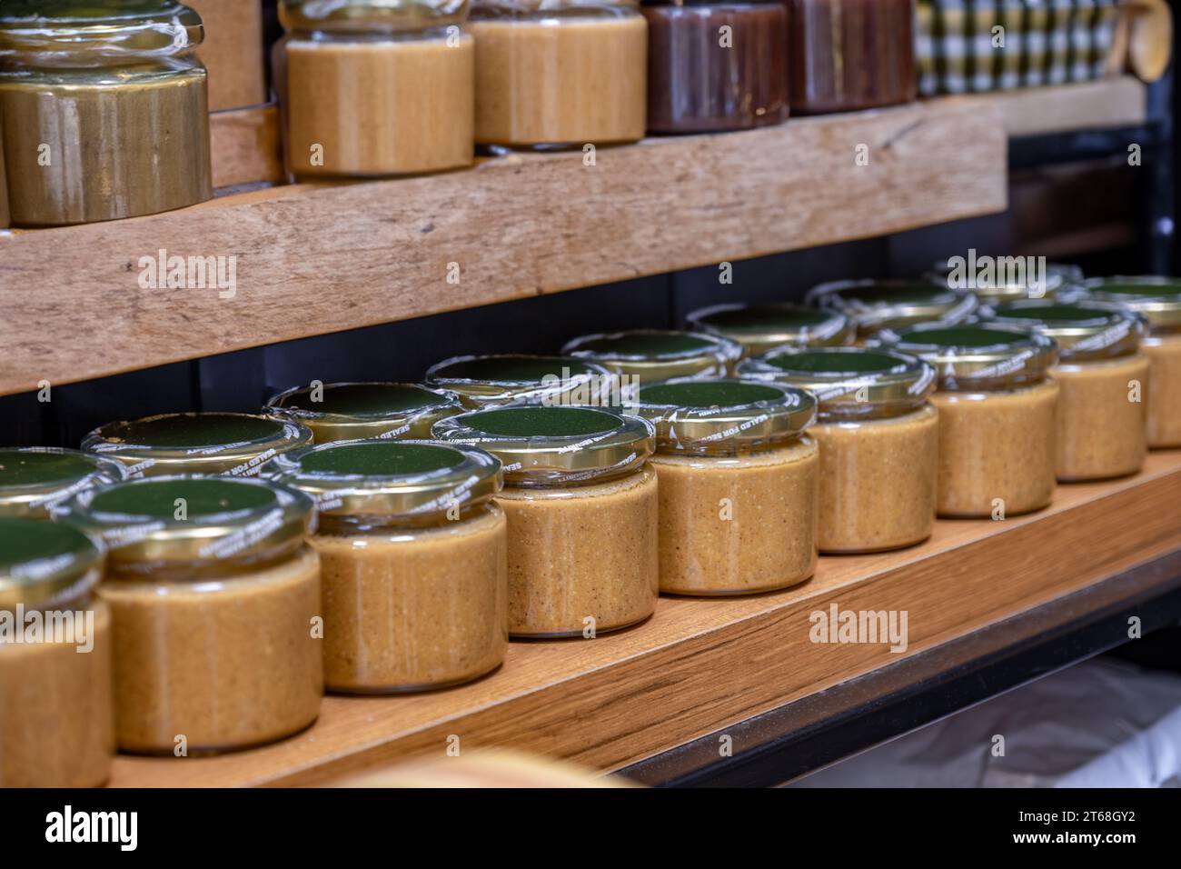 jars of cream on store shelf with price tag under the jar on black ...