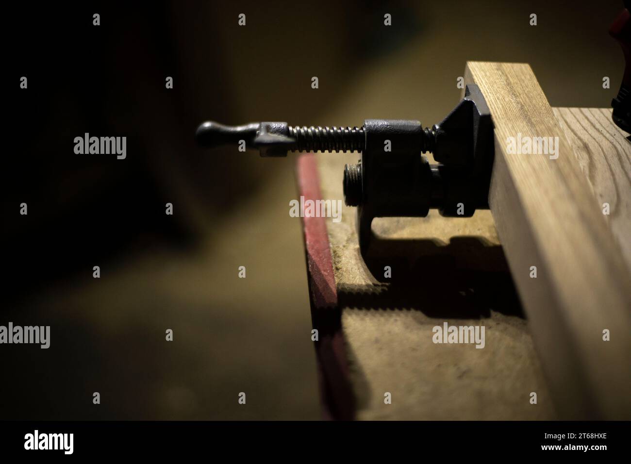 Clamp in workshop. Board holder. Details of work Stock Photo - Alamy