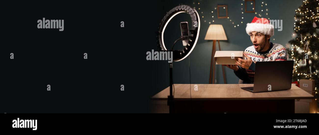 Creative tech arab man recording unboxing video with smartphone camera ...