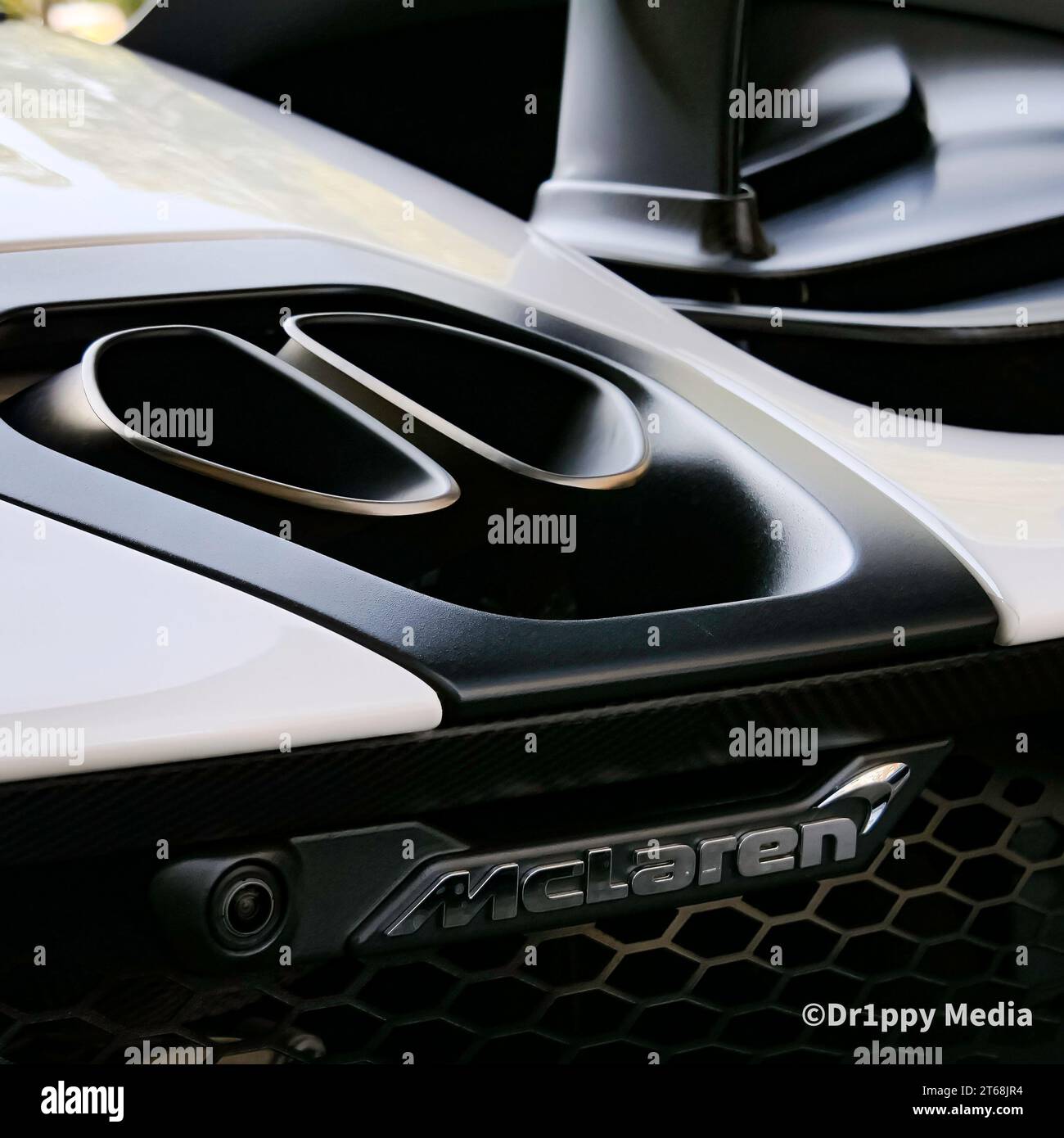 A vivid close-up shot of the front of a modern sport car, showcasing ...