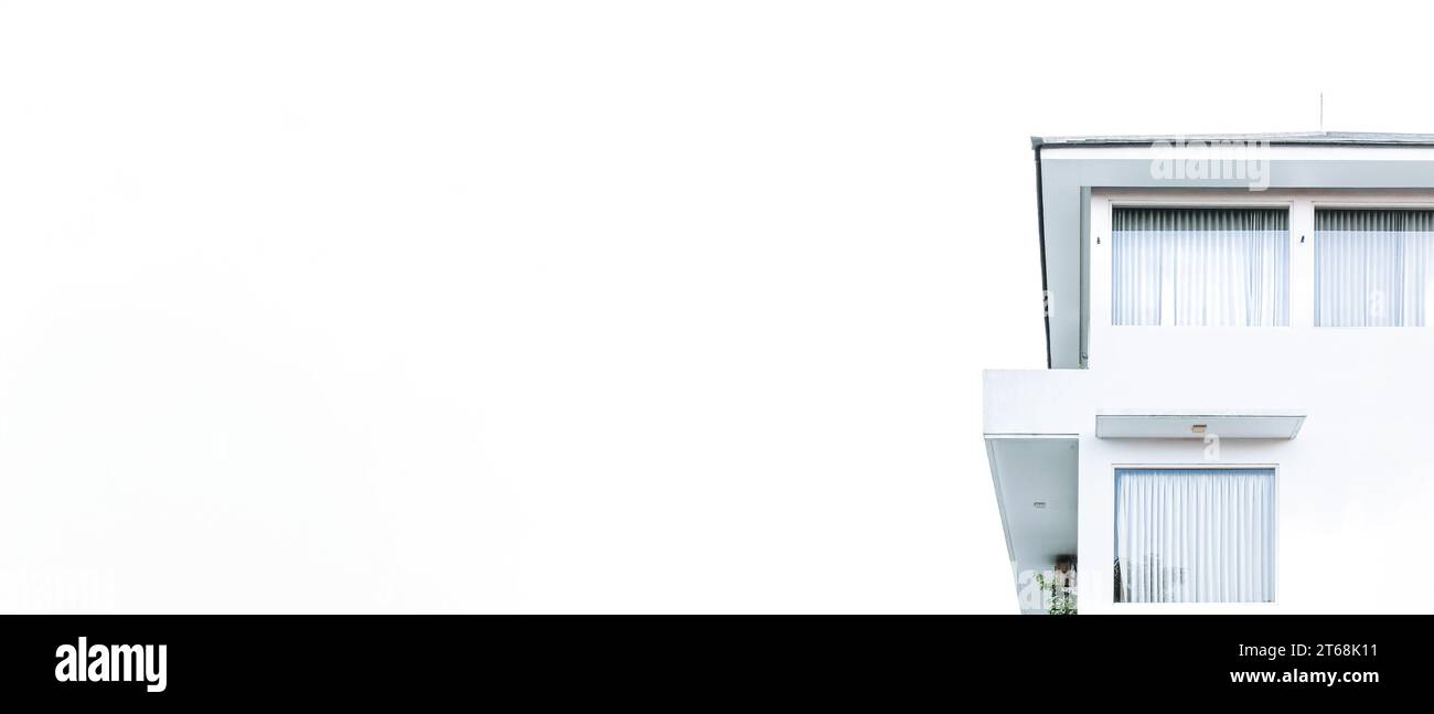 Minimalist white house with three rectangle windows and blinds. Clean ...