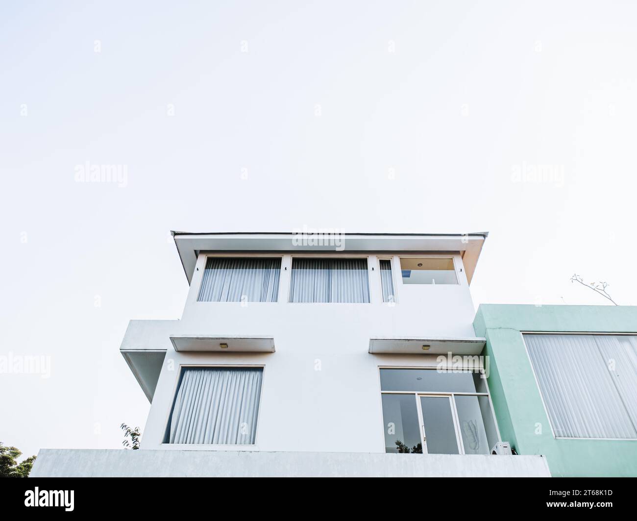 Minimalist white house with windows and blinds. Clean lines ...
