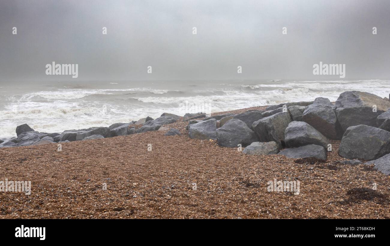 Choppy sea with rocks and pebbles Stock Photo - Alamy
