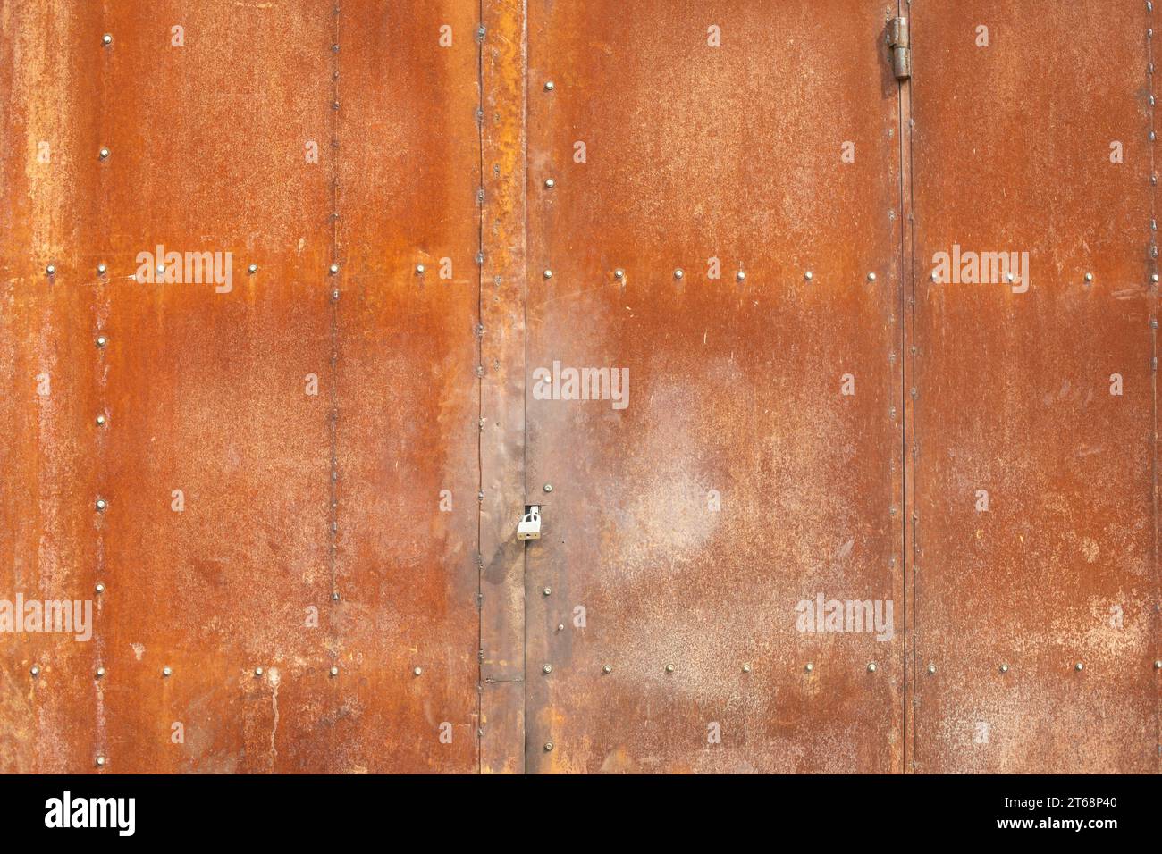 Rusty gates. Entrance to workshop. Industry in detail. Rusty metal ...