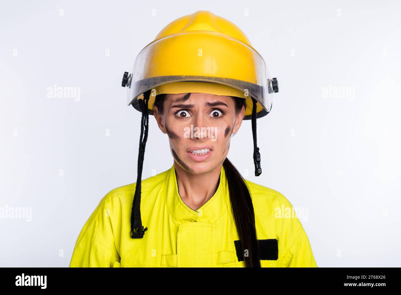 Photo of young woman firefighter afraid scared shocked terrified ...