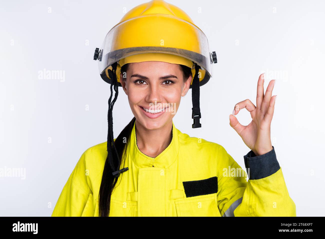 Photo of charming good mood young fire lady workwear yellow helmet ...