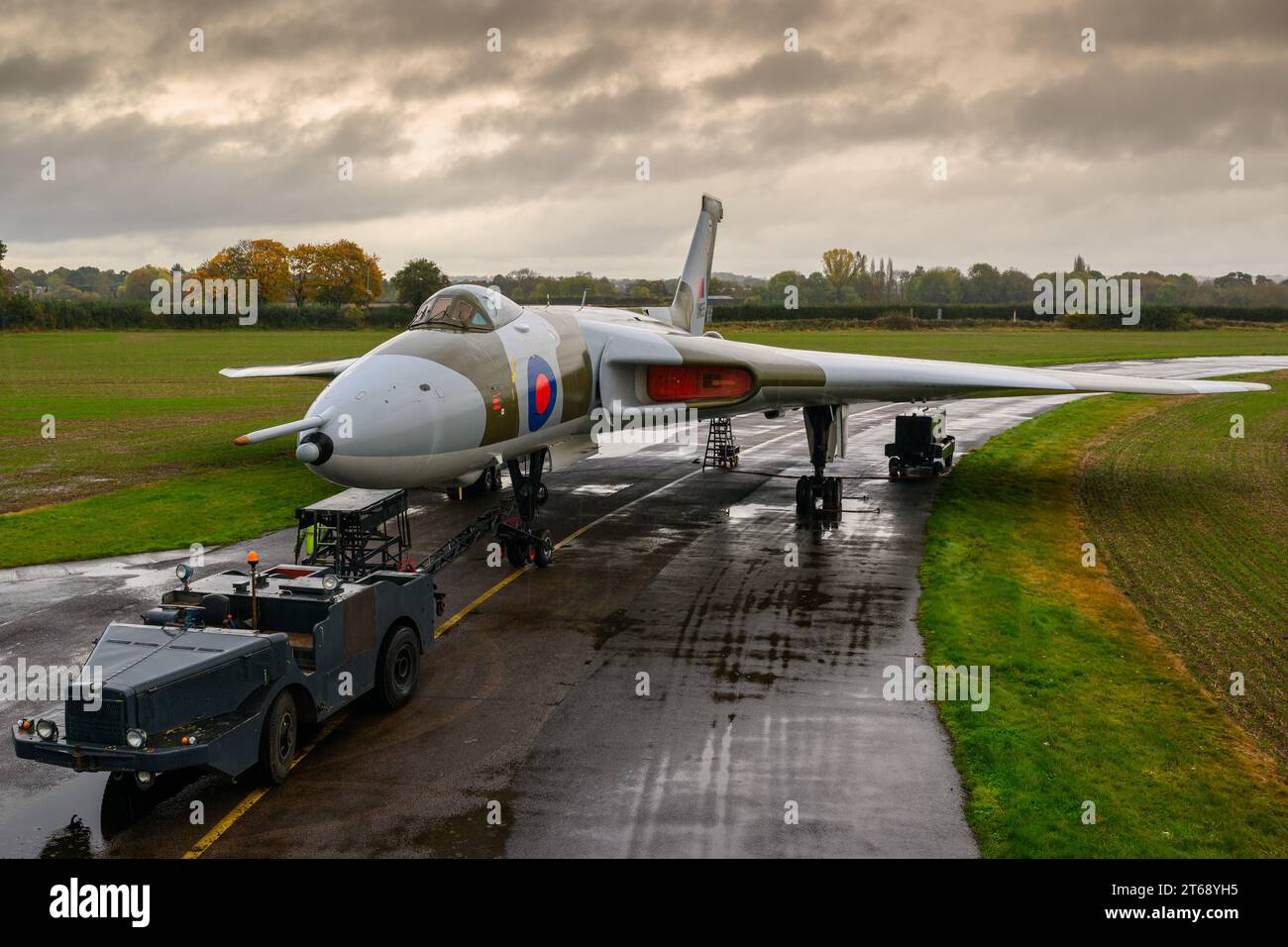 Avro Vulcan XM655 with a vintage Douglas Aircraft Tug Stock Photo - Alamy