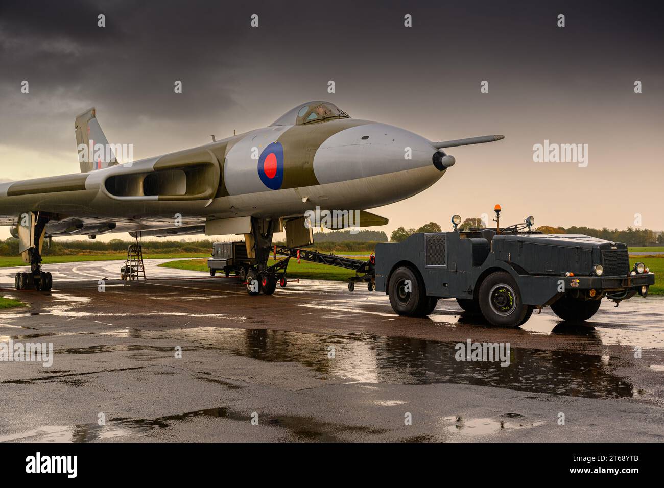 Avro Vulcan XM655 with a vintage Douglas Aircraft Tug Stock Photo - Alamy