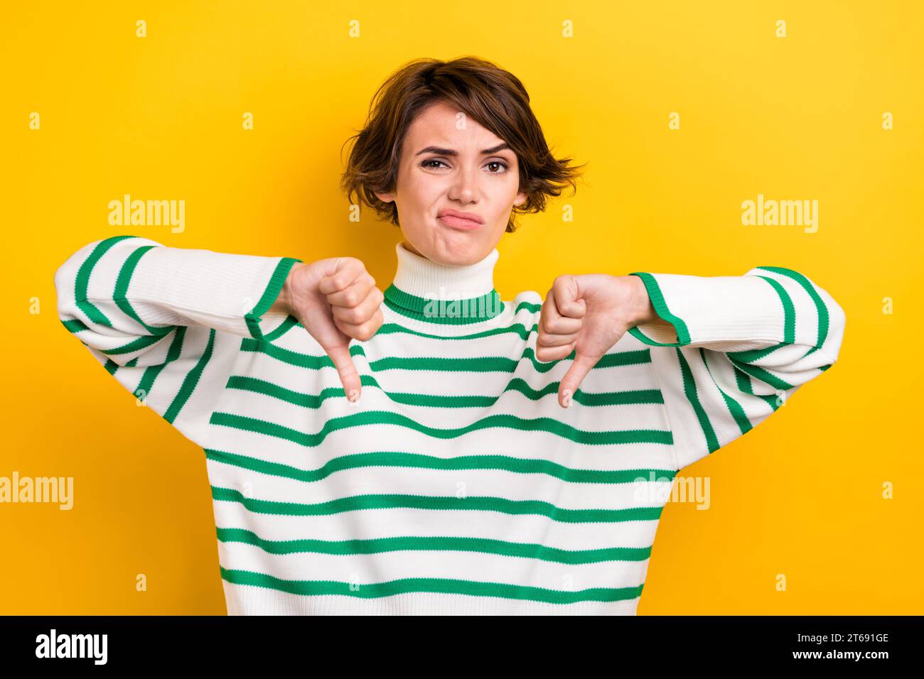Portrait of unsatisfied young girl sullen face hands fingers ...