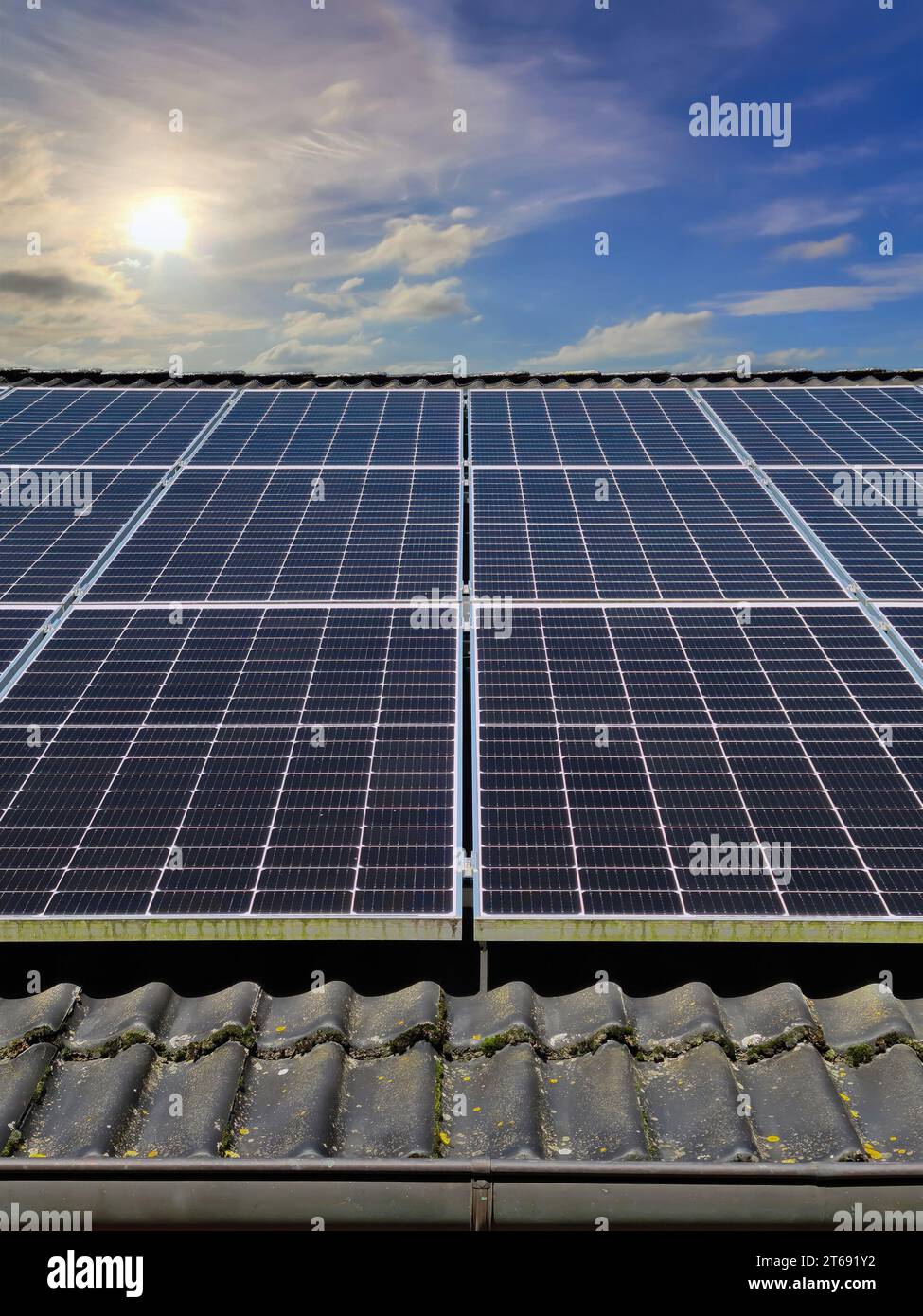 Solar panels producing clean energy on a roof of a residential house ...