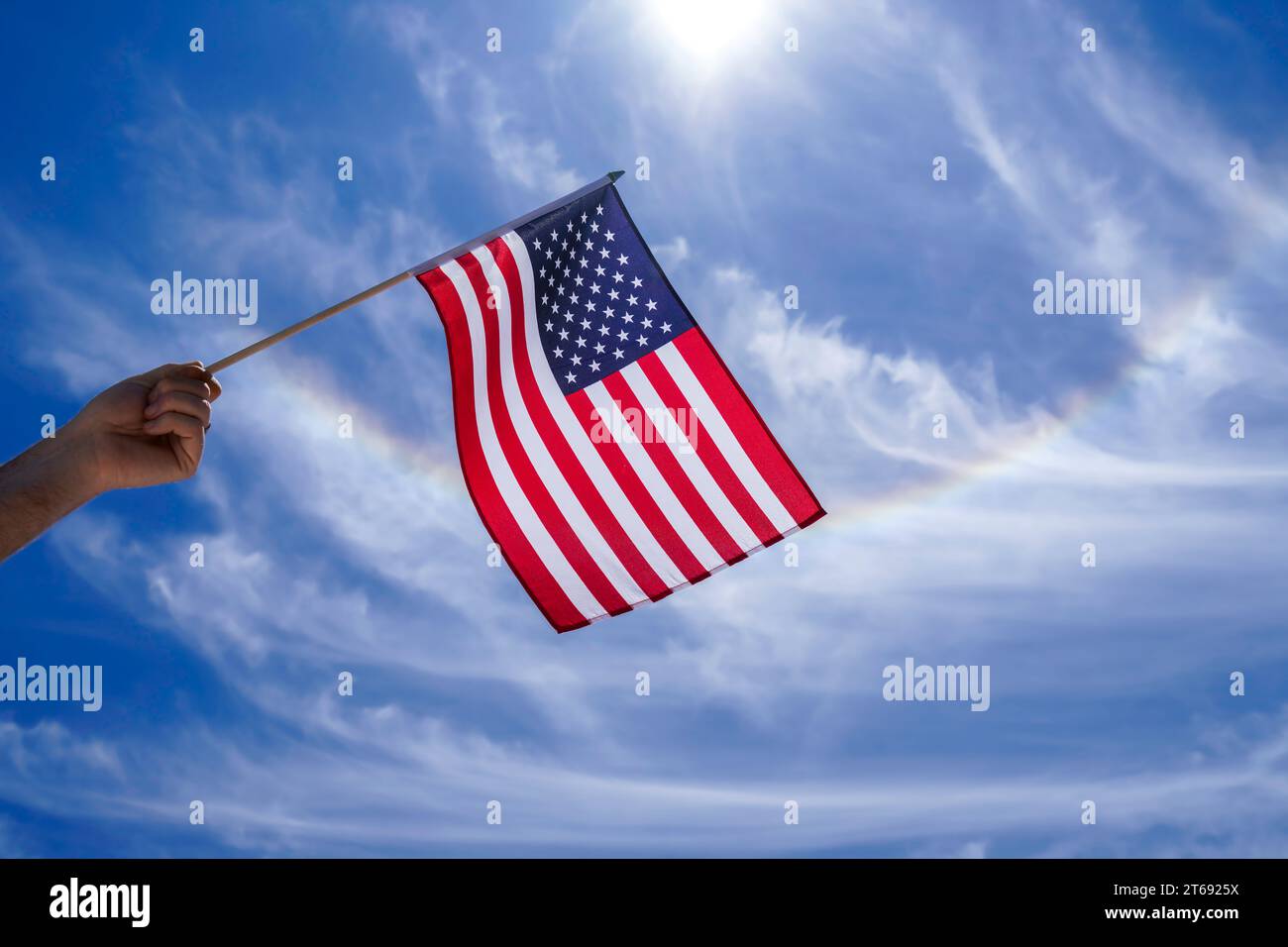 Person waving an American flag, US flag with a rainbow color streak ...
