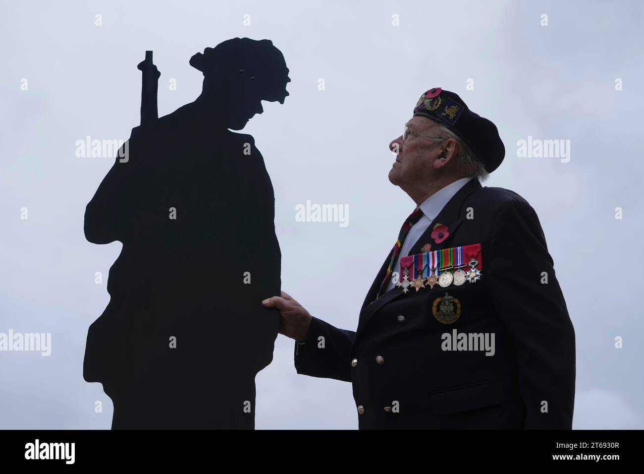 Normandy Veteran Ken Hay MBE, poses with an art installation of life ...