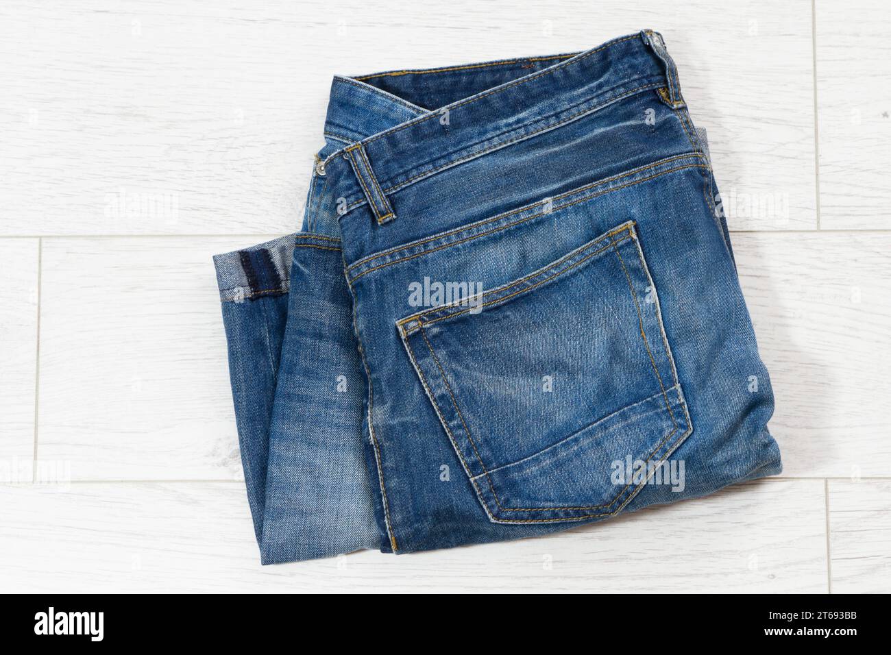 Folded denim on floor hi-res stock photography and images - Alamy