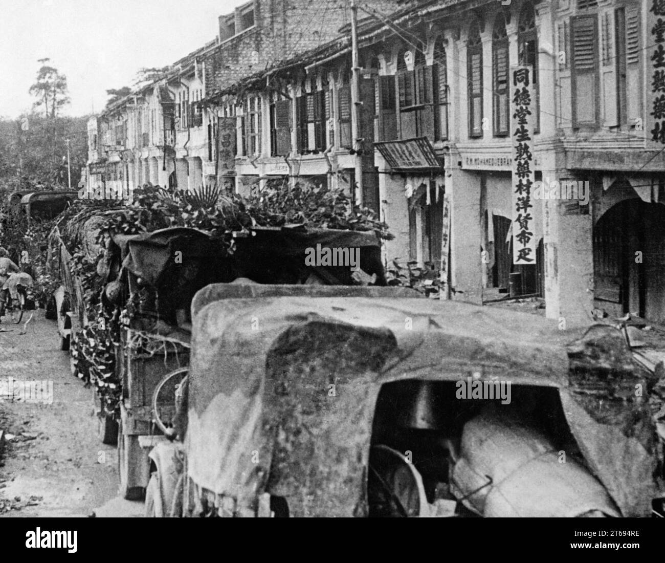 Japanese truck column in a town in French Indochina. [automated ...