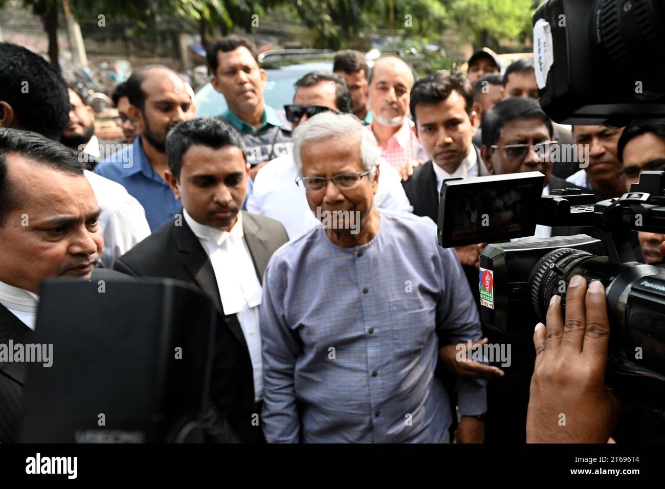 Nobel laureate Muhammad Yunus (C) arrives with his lawyers for a ...