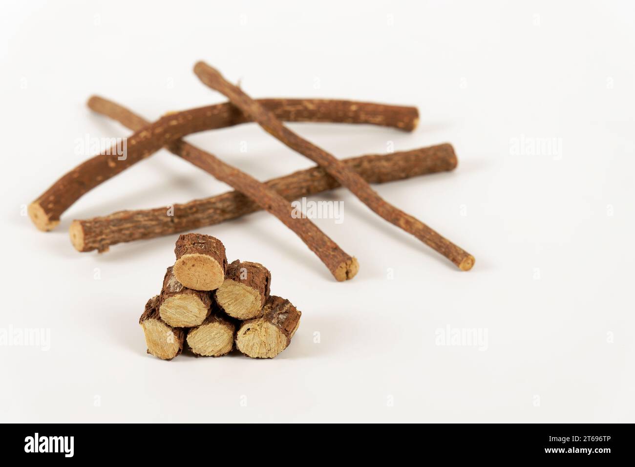 group of sliced natural licorice roots isolated on a white background ...