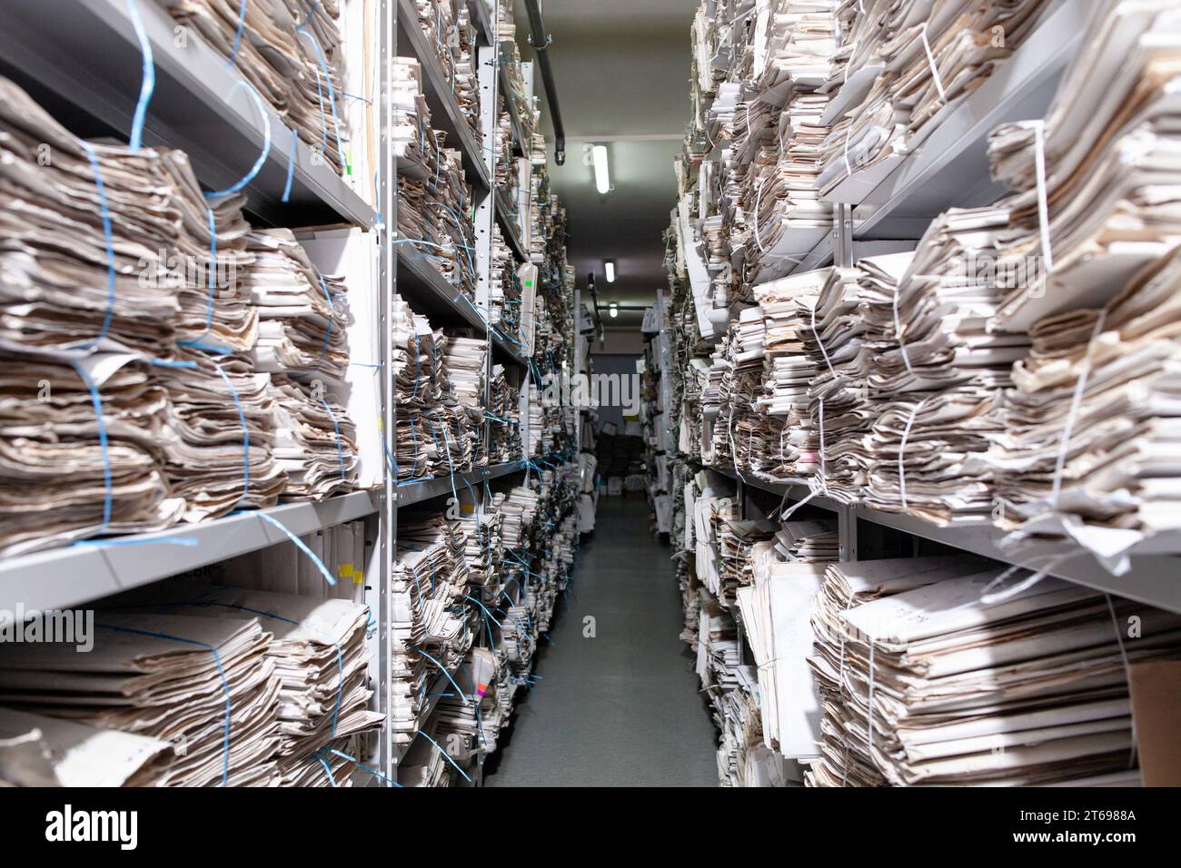 shelves with paper documents. Organized office space with neatly ...