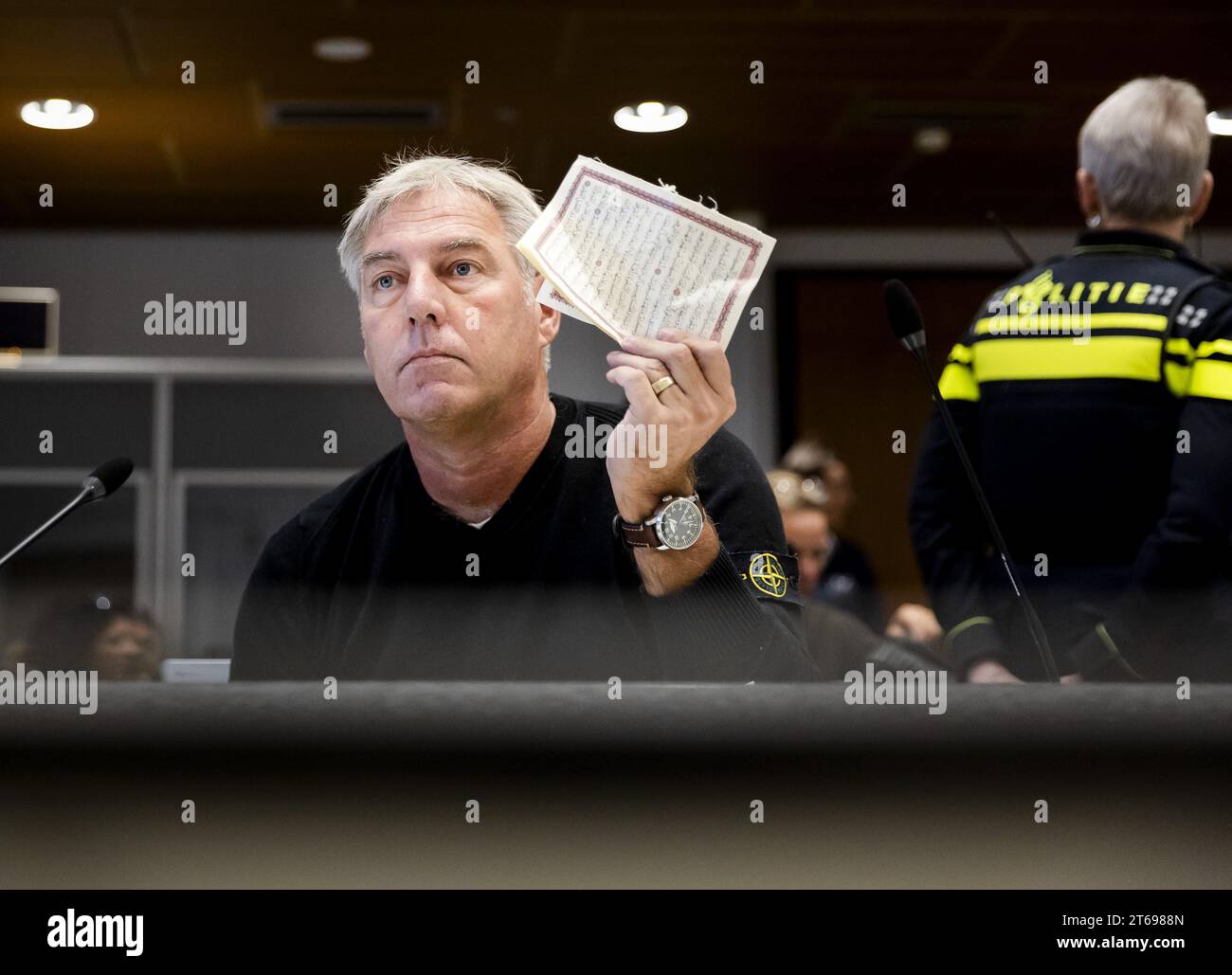 THE HAGUE - Pegida leader Edwin Wagensveld shows a torn page of the ...