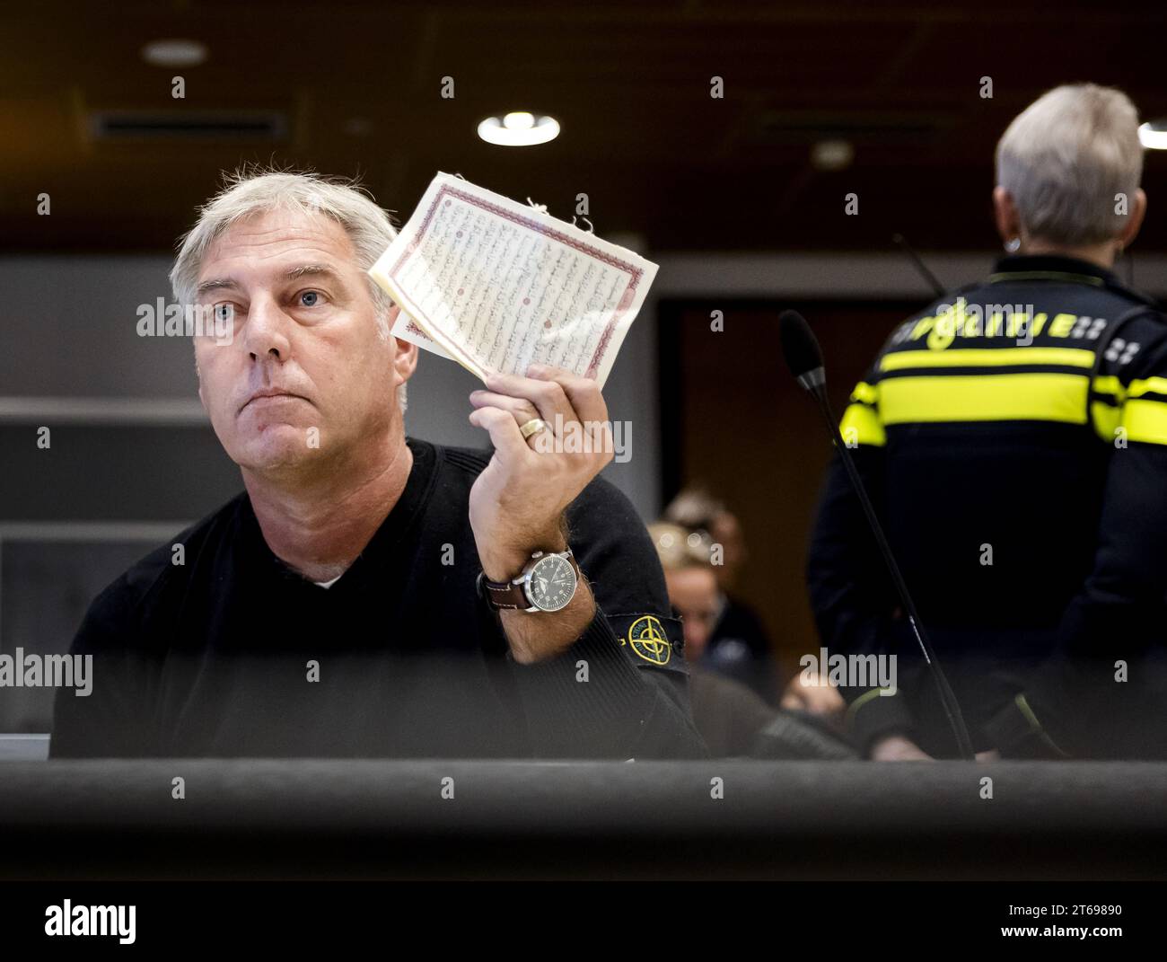 THE HAGUE - Pegida leader Edwin Wagensveld shows a torn page of the ...