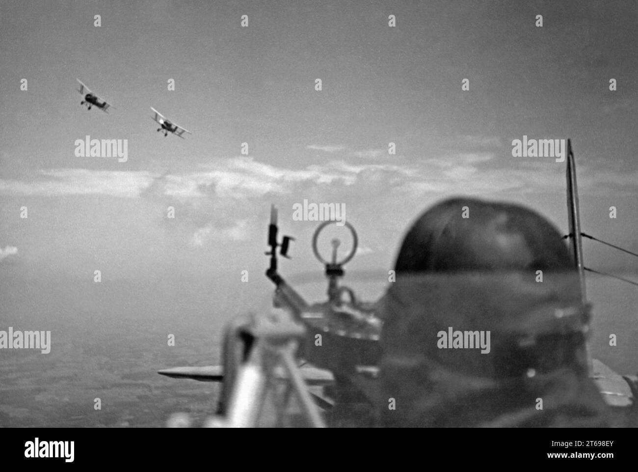 The gunner of a Japanese aircraft aims at attacking enemies during an ...