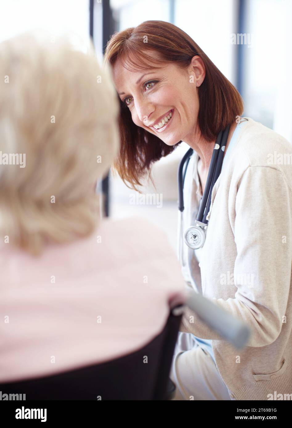 A comfort to her patients in their time of need. Mature nurse has a ...