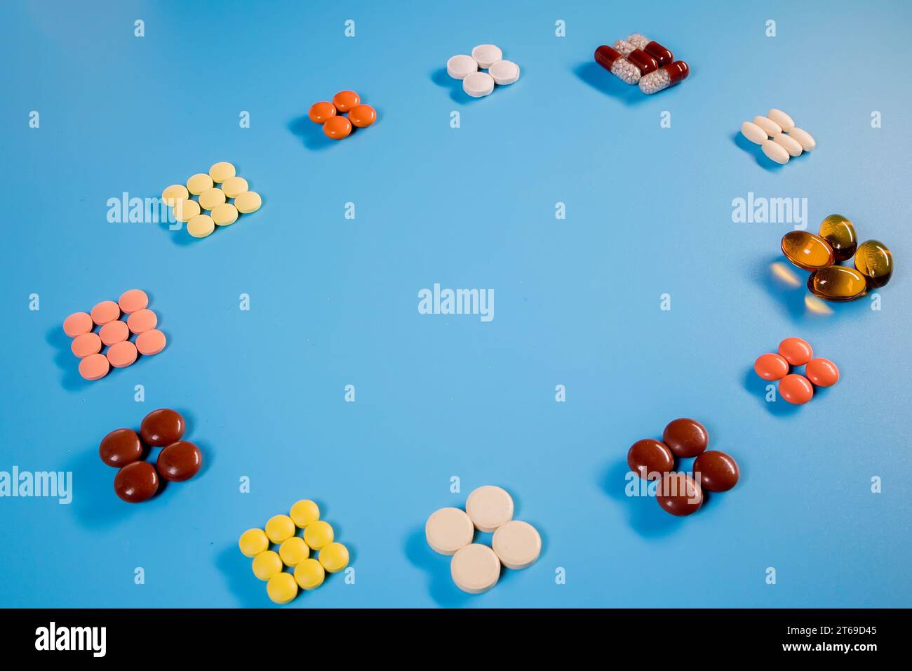 Medical concept. Tablets of different shapes are laid out in an oval ...