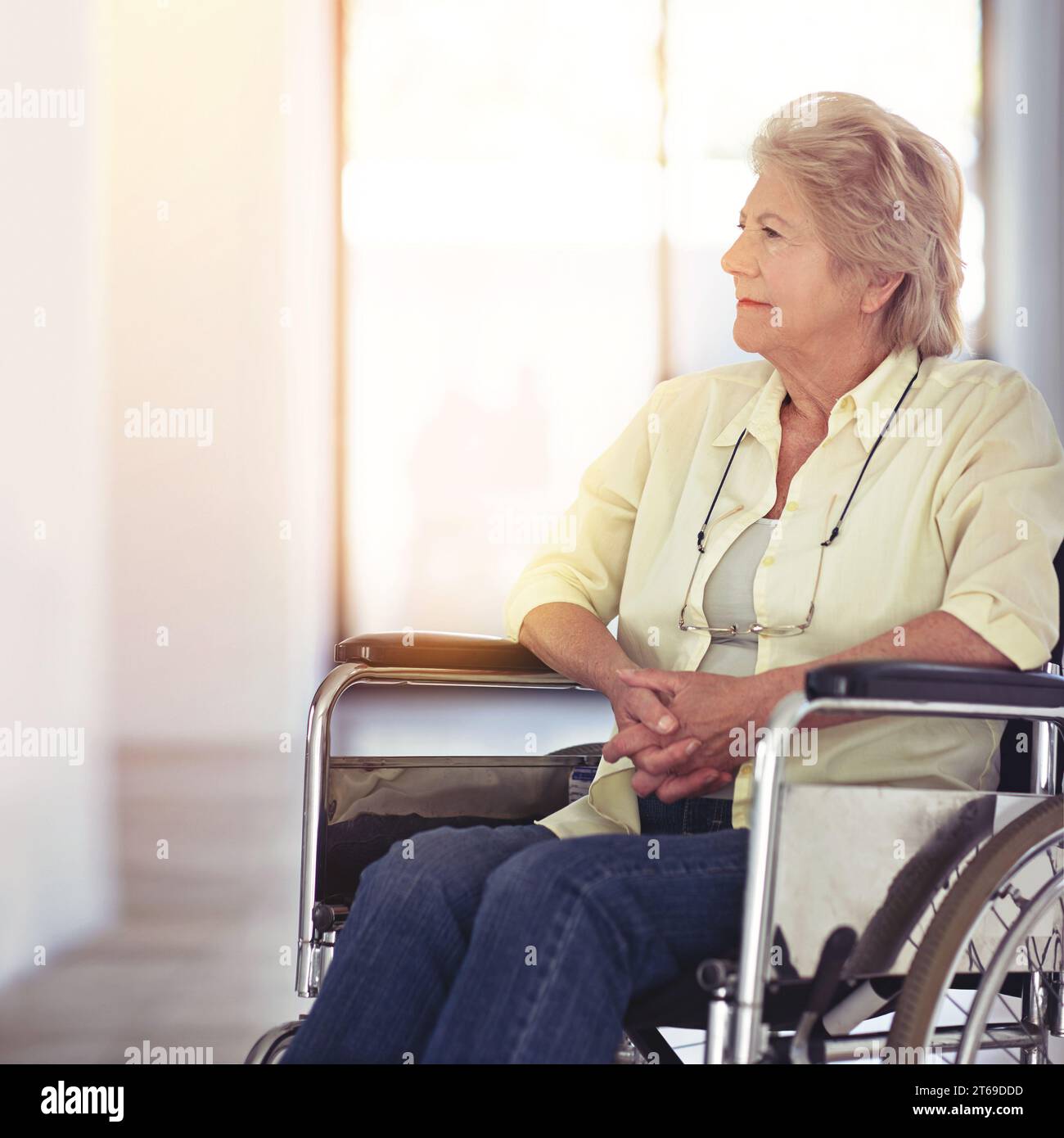 Taking a trip down memory lane. a senior woman looking thoughtful while ...