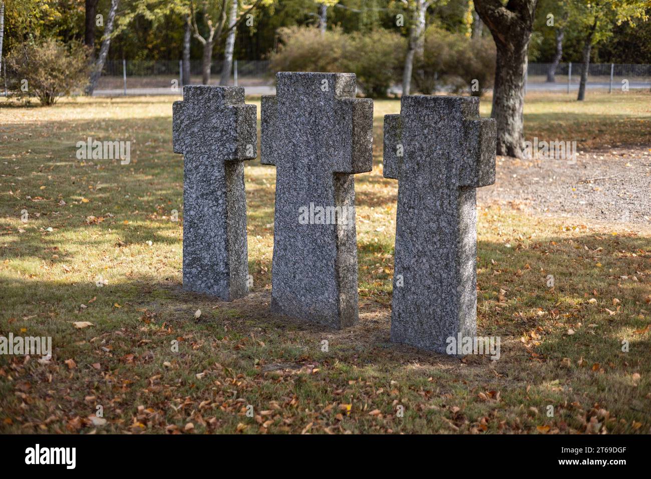 Stone tombstones in the German cemetery in the fall. Beautiful German ...