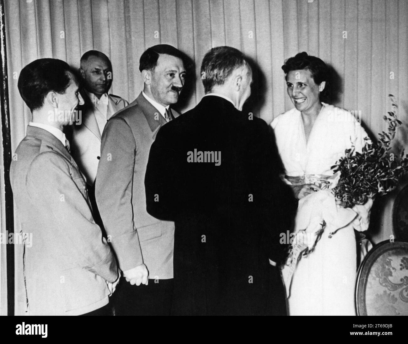 The Greek Ambassador Rangabe gives Leni Riefenstahl (right) an olive ...